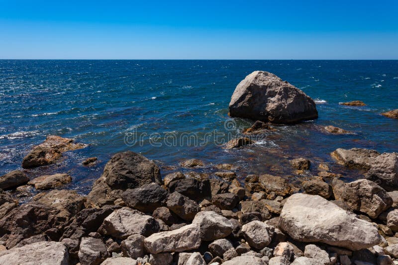Seascape - Sharp Stones of Different Sizes Lie on the Seashore and in ...