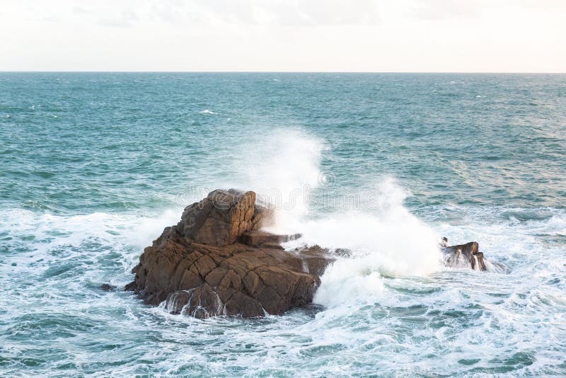 Seascape with Waves Crashing a Rock in a Water Stock Photo - Image of ...