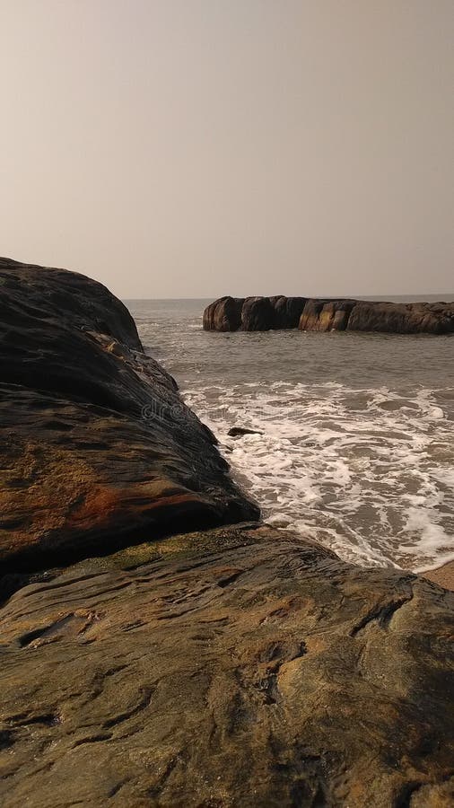 Seashore on rock side stock photo. Image of seascape - 138088588