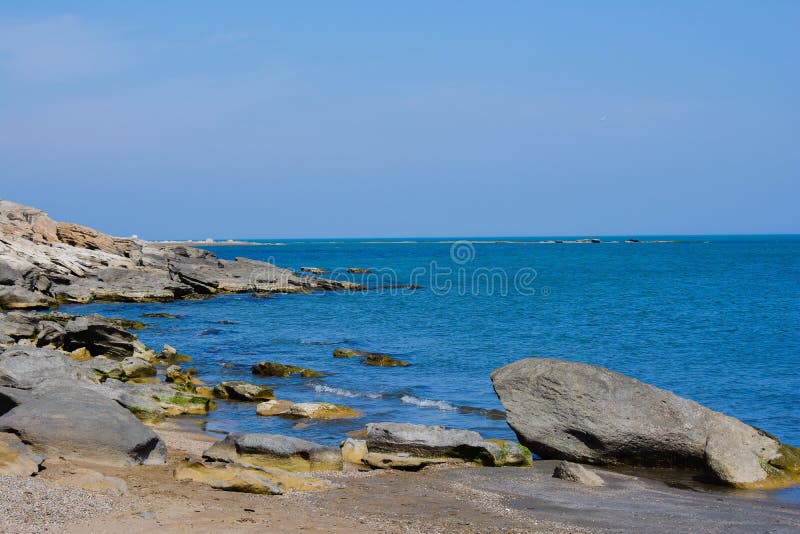 Rocks on Seashore Blue Water Stock Photo - Image of ocean, asian: 51973194