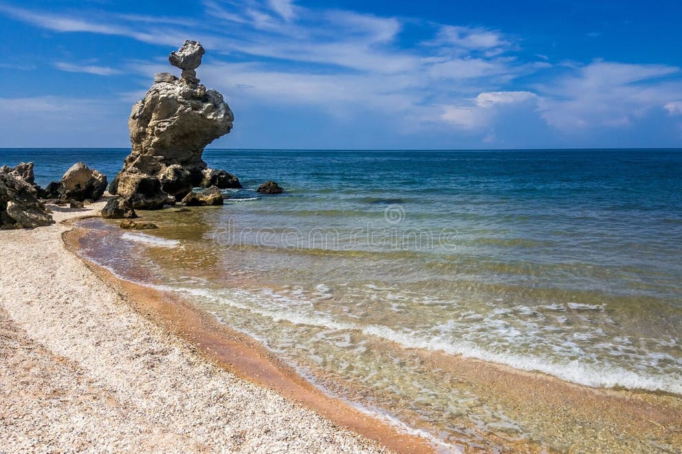 Seashore, Shell Beach and Rocks Stones of Bizarre Frame on Clear Day ...