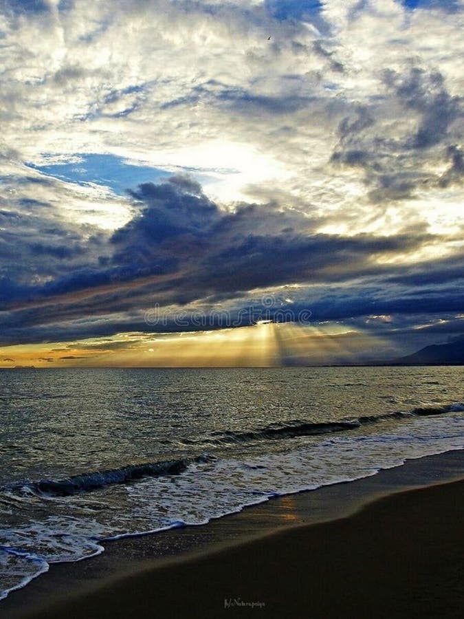 Seashore at sunset stock image. Image of tide, light - 101321483