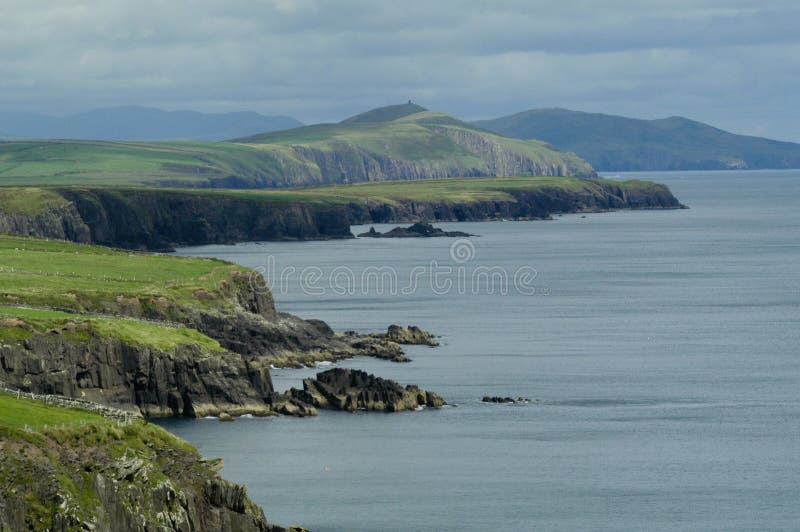Seaside Cliffs in Ireland on a Cloudy Day Stock Image - Image of water ...