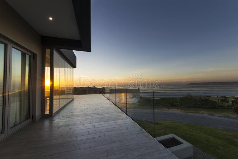 Seaside home sunrise stock photo. Image of sunrise, glass - 43462478