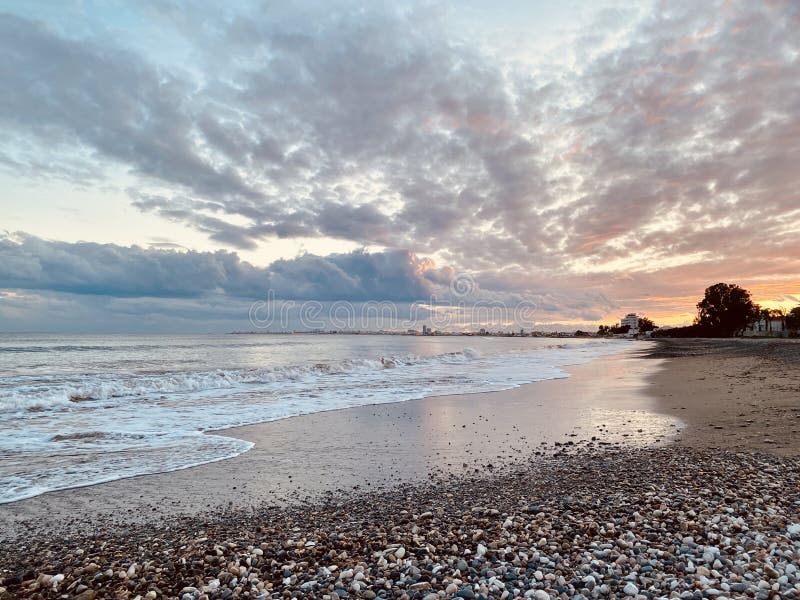 Seaside Pebble Beach Sunset Stock Image - Image of ocean, couple: 269557293