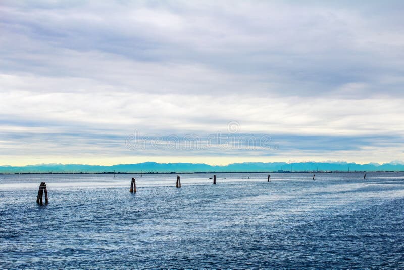 Seaside with piling stock image. Image of cloudscape - 76809515