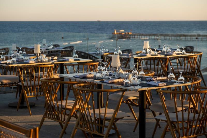 Seaside Restaurant Tables Set for an Exquisite Dining Experience ...
