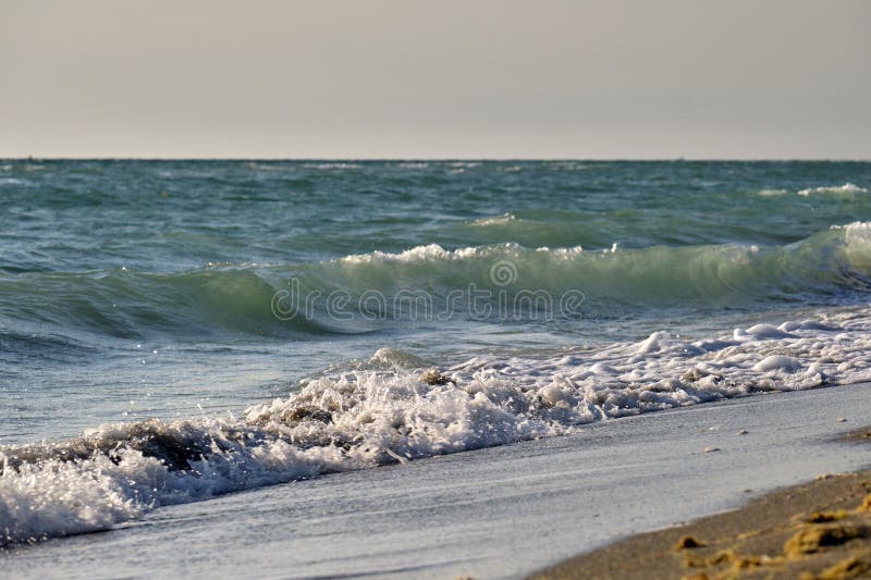 Seaside Sand Beach with Foamy Waves Crushing on Shore Stock Image ...