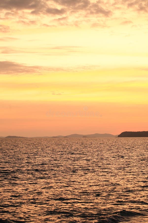 The Seaside at Sunset Has Dark Shadows in the Form of Mountains Stock ...