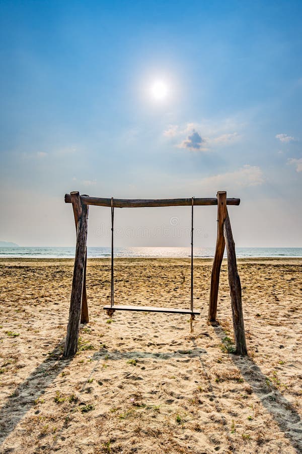 Seaside Swing with Sunset on the Beach Stock Image - Image of shore ...