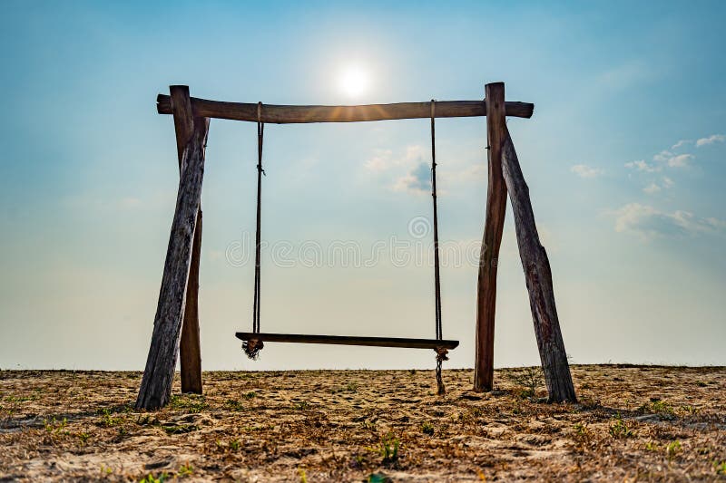 Seaside Swing with Sunset on the Beach Stock Image - Image of sandy ...