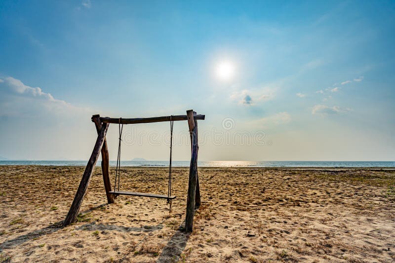 Seaside Swing with Sunset on the Beach Stock Image - Image of paradise ...