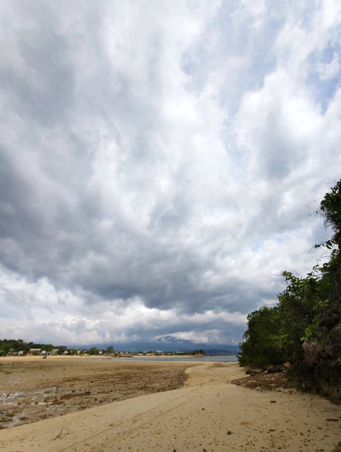 Seaside Tranquility during Low Tide Hour with Vibrant and Dramatic Sky ...