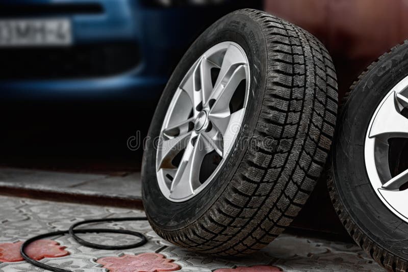 Seasonal Replacement of Car Tires. Stock Image - Image of change ...