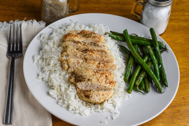 Seasoned Chicken Breast on Rice Served with Green Beans Stock Image ...