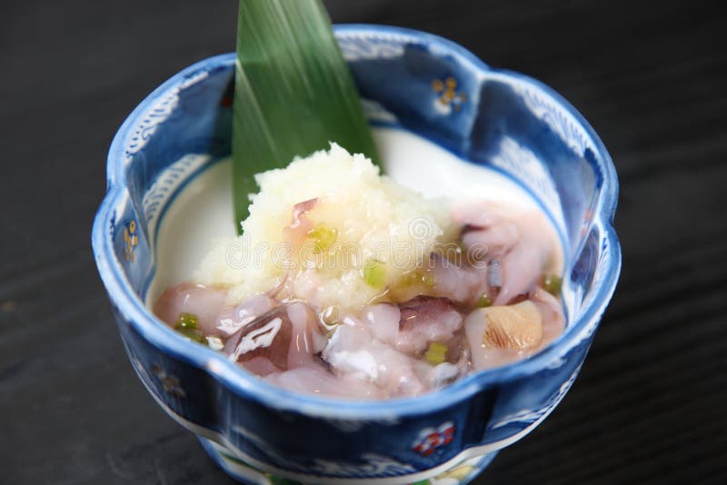 Seasoned Octopus with Wasabi on a Dining Table Stock Photo - Image of ...