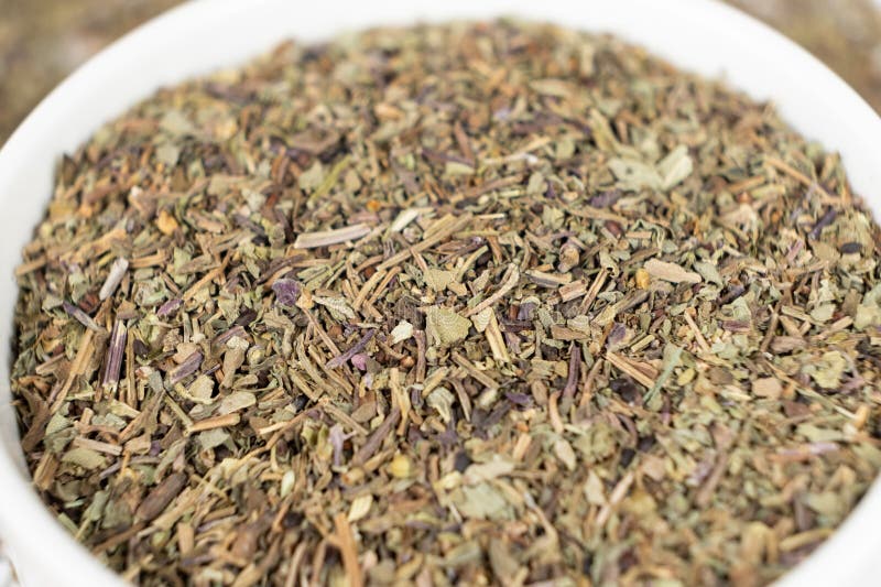 Seasoning Dried Basil in a Plate, Macro Chopped Basil Stock Photo ...