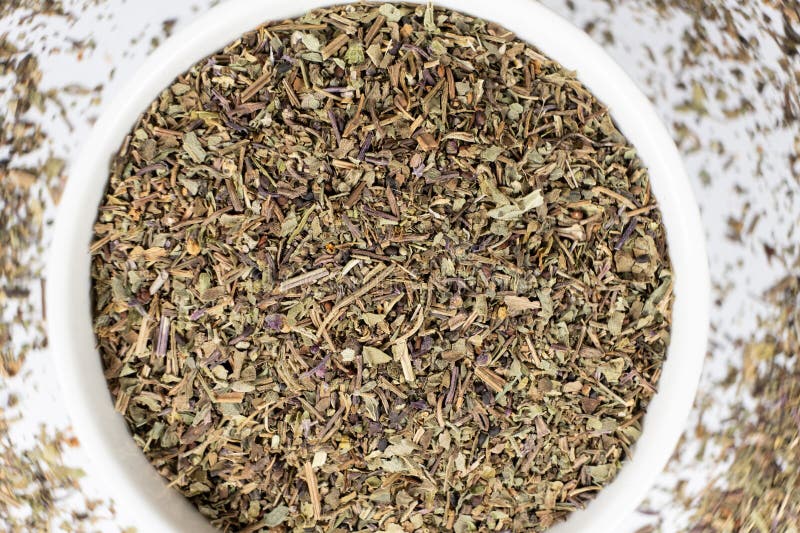 Seasoning Dried Basil in a Plate, Top View of Chopped Basil Close-up ...