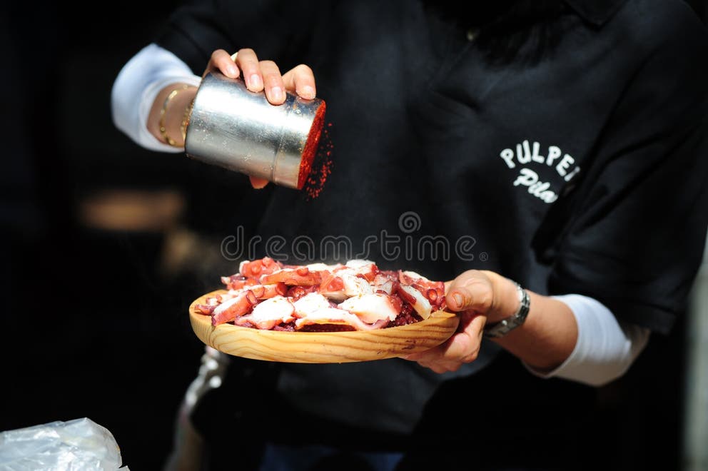 Seasoning the Octopus with Spicy Pepper Stock Photo - Image of european ...