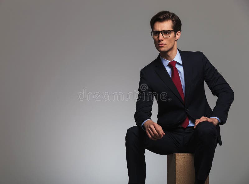 Seated Elegant Man with Grey Hair Touching Face and Thinking Stock ...