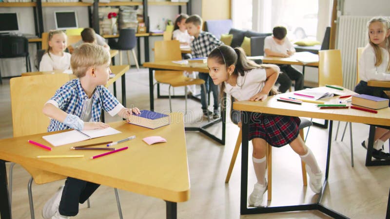 Two Classmates, a Boy and a Girl, Elementary School Students, are ...