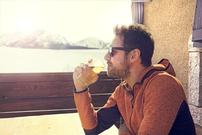 Seated and Relaxed Man Drinking a Beer in Peace Stock Photo - Image of ...