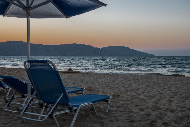Seating on the Sunset Beach Stock Photo - Image of sand, calm: 137286762