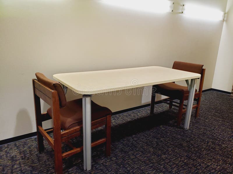 Seating and Table Against White Wall Study Area Stock Image - Image of ...