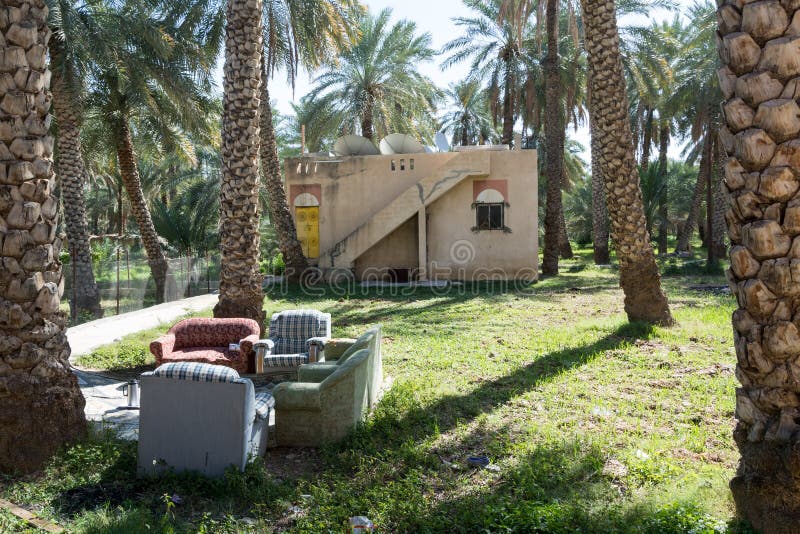 Seats in Front of a Clay House in a Green Oasis Stock Photo - Image of ...