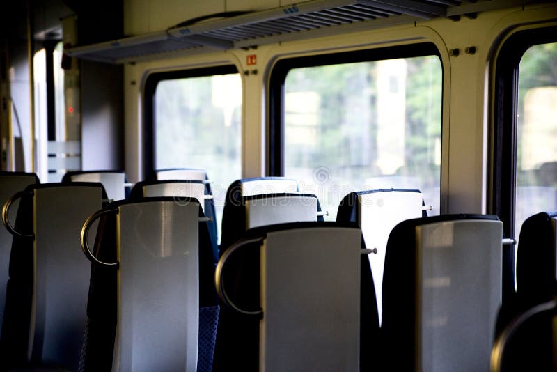 Seats in the train stock photo. Image of colour, rail - 94327488