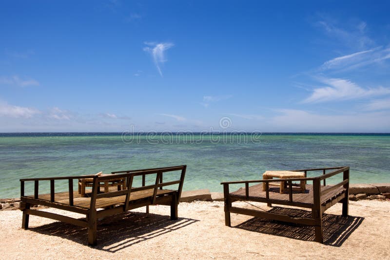 Seats on a tropical beach stock image. Image of perch - 11339533