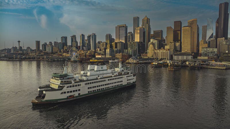 Seattle Ferry Terminal Shows Seattle Ferry &.Seattle Skyline at Sunset ...