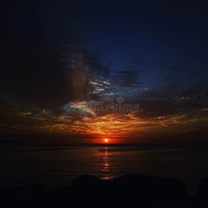 Seaview at sunset time stock photo. Image of fishing - 130444772