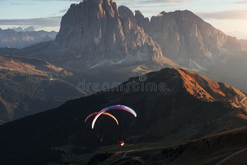 The Seceda Dolomites and Two Paragliders on the Sunset Lights Stock ...