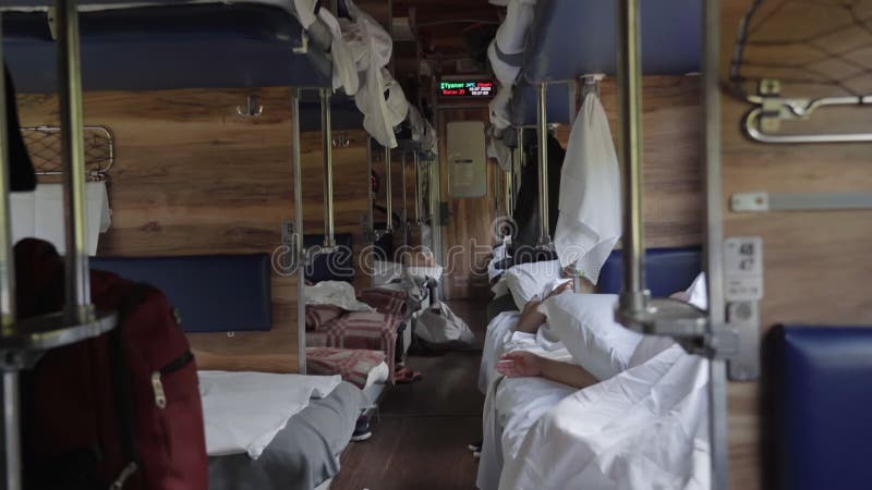 Second-class Carriage with Passengers in the Russian Train. Long ...