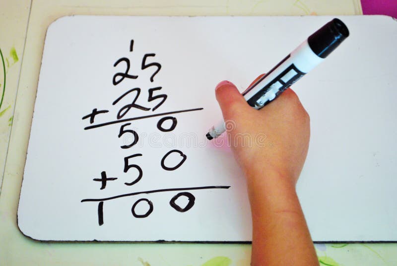 Second Grade Girl Learning How To Carry the One on a Whiteboard while ...