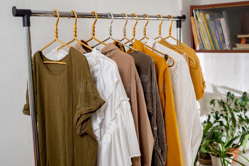 Second-hand Clothes on the Rail at Home. Stock Image - Image of ...