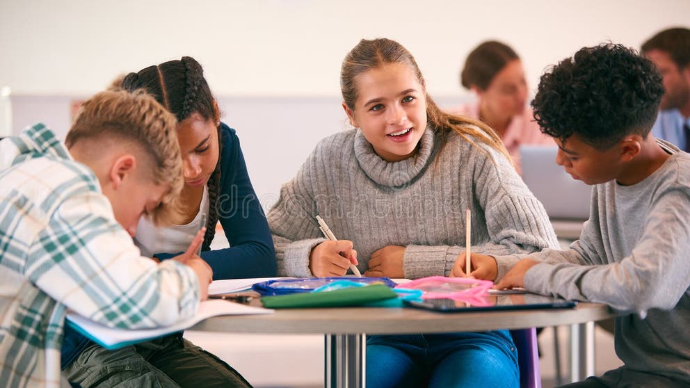 Secondary or High School Students Collaborating in Study Area with ...