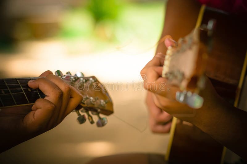 Secondary School Students are Learning How To Play Guitar in Sch Stock ...