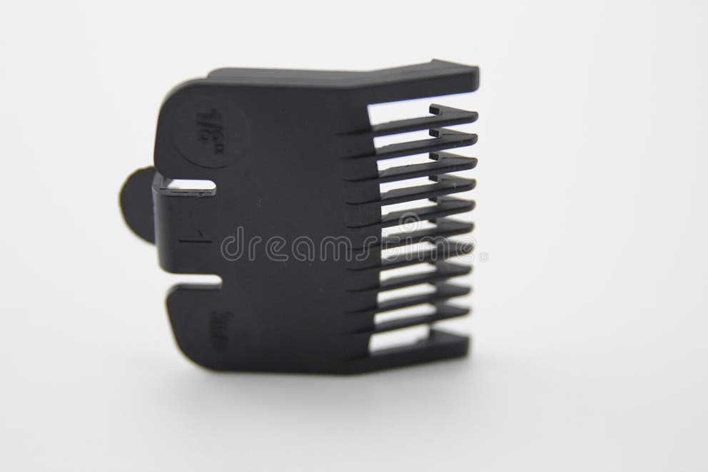 Secondary Teeth for Use with the Clipper Placed on a Gray Background ...