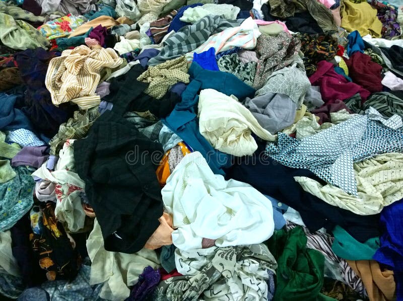 Messy Clearance Section in a Clothing Store, with Colorful Garments on ...