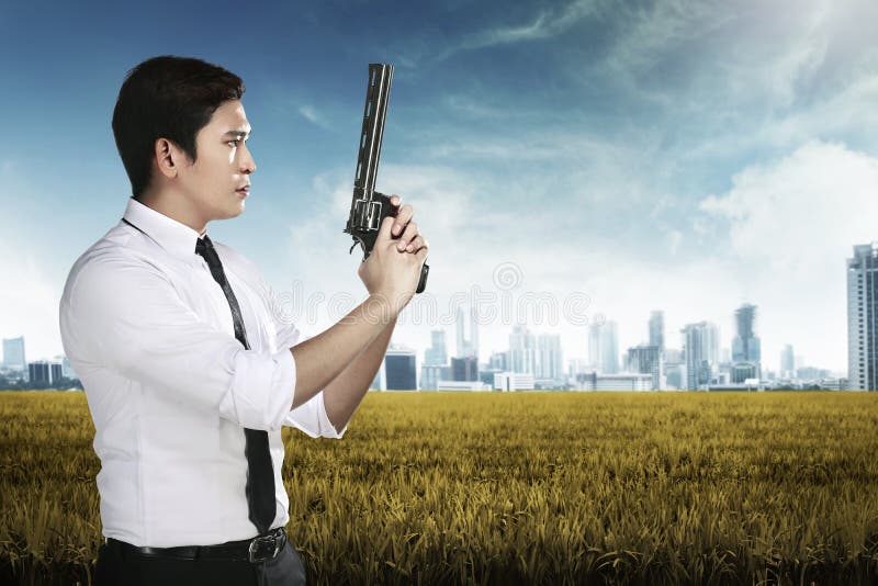 Secret Agent Holding Gun stock photo. Image of crime - 64511040