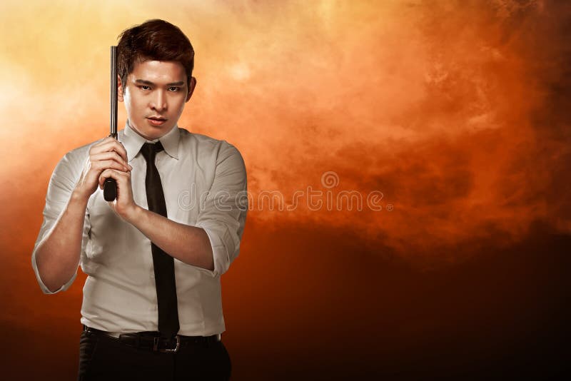 Secret Agent Holding Gun stock photo. Image of businessman - 64511098
