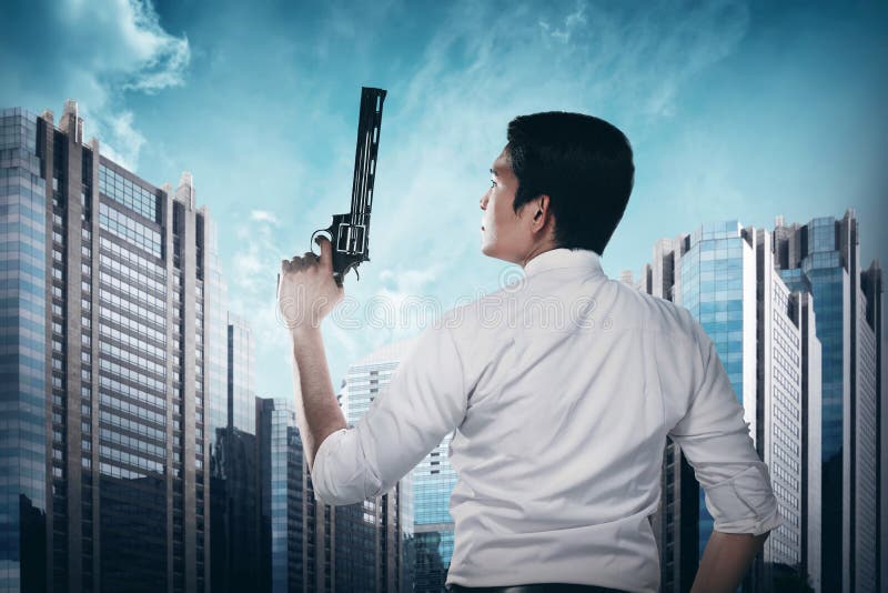 Secret Agent Holding Gun stock photo. Image of chinese - 65159634