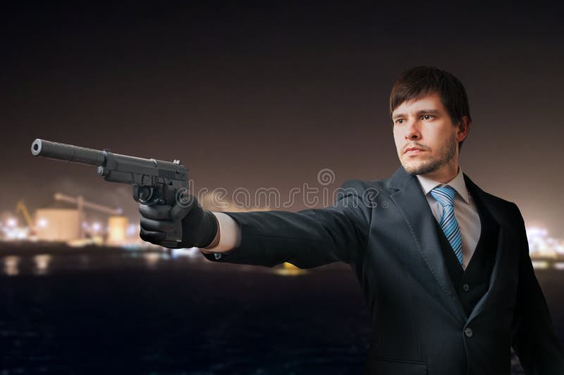 Secret Agent or Spy is Aiming with Pistol at Night Stock Image - Image ...