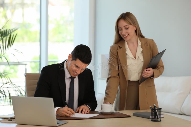 Secretary Bringing Coffee To Boss in Office Stock Photo - Image of ...