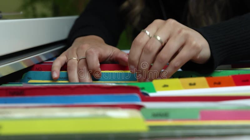 Secretary Methodically Searching through Files in Slow Motion Stock ...