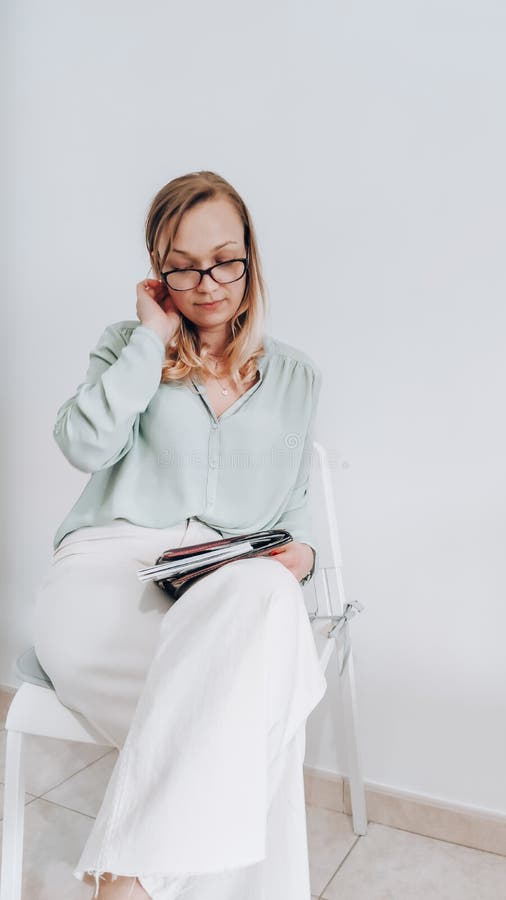 The Secretary Sits on a Chair and Asks for Notes Stock Image - Image of ...