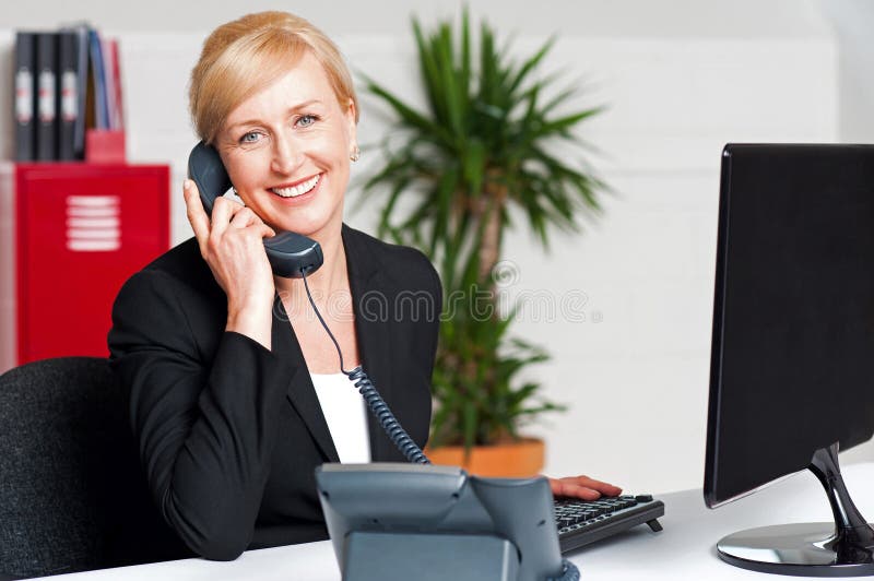 Secretary Talking on Phone with Client Stock Photo - Image of call ...