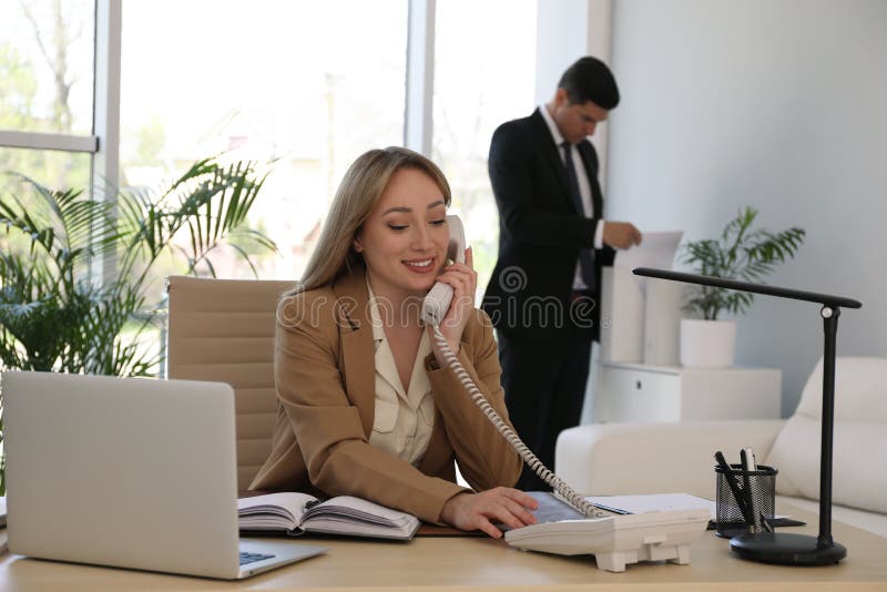 Secretary Talking on Phone at Workplace in Office Stock Image - Image ...